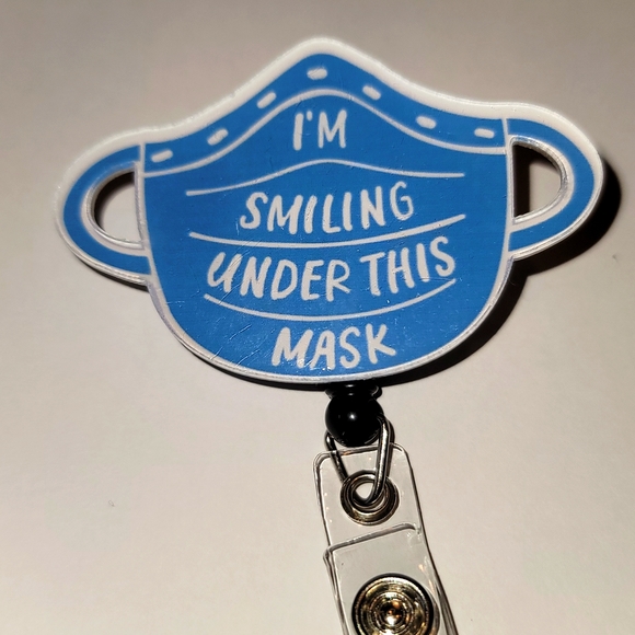 Simple Sass | Accessories | Im Smiling Under This Mask Badge Holder ...